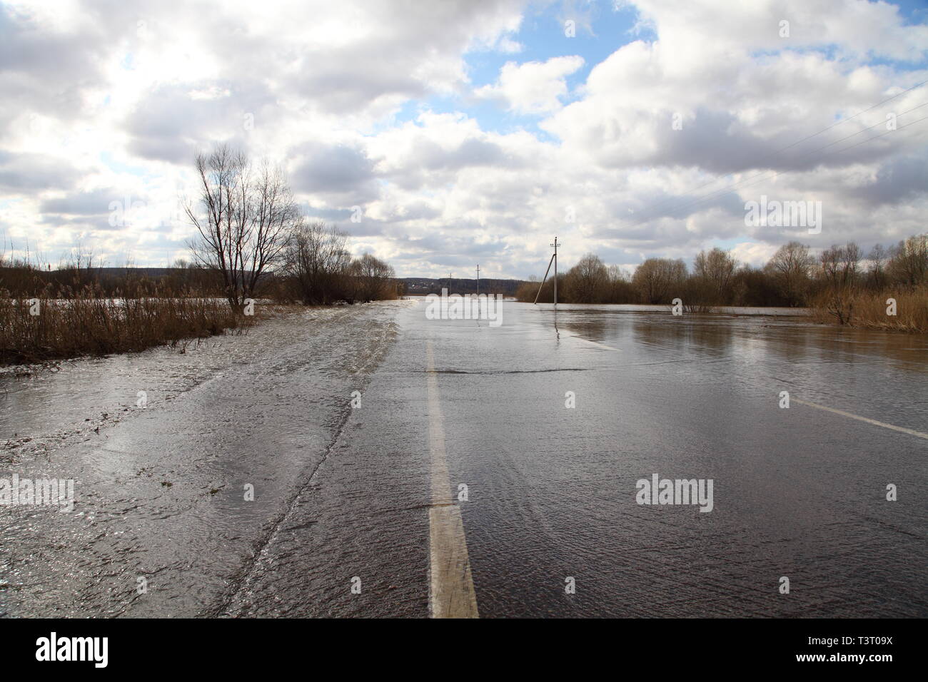 Water flooded the road. Spring flood of the river Stock Photo - Alamy