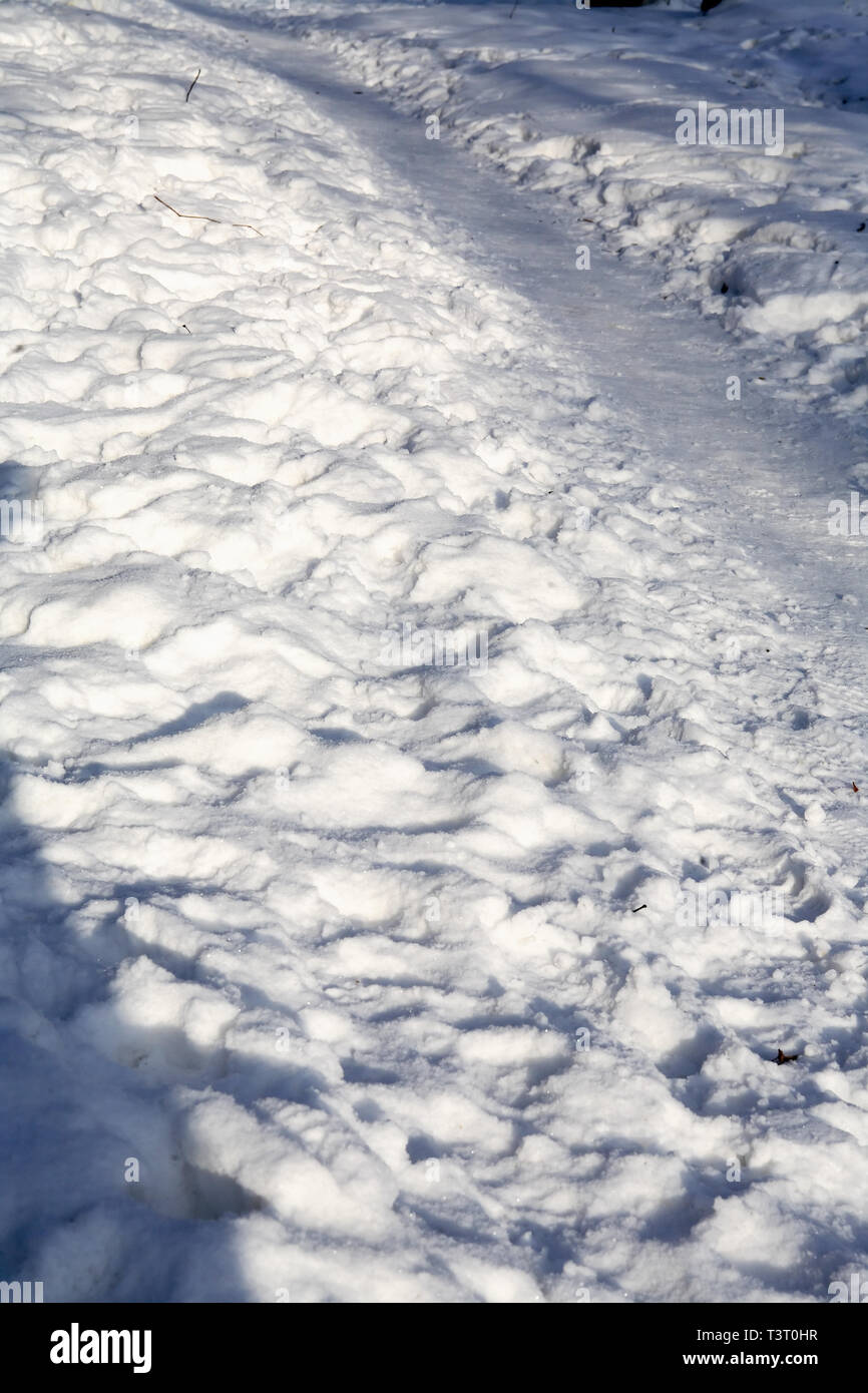 Winter background with footpath across snow Stock Photo - Alamy