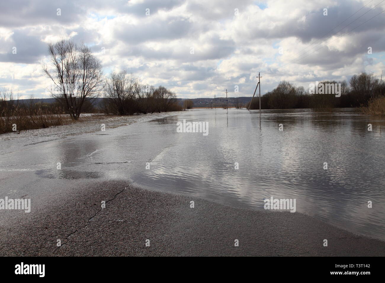 Water flooded the road. Spring flood of the river Stock Photo - Alamy