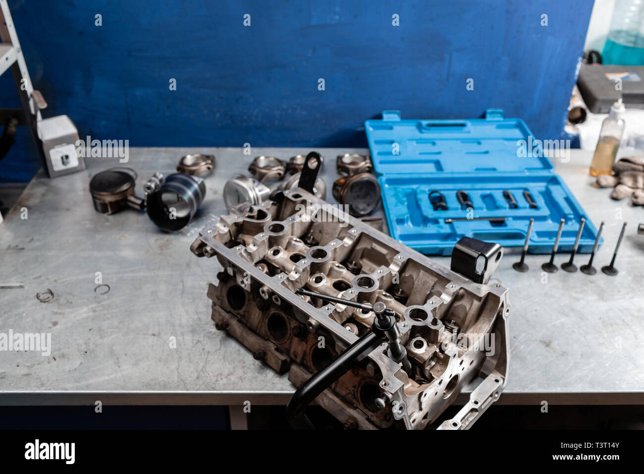 Disassembled engine block is on the table. the mechanic opened the ...