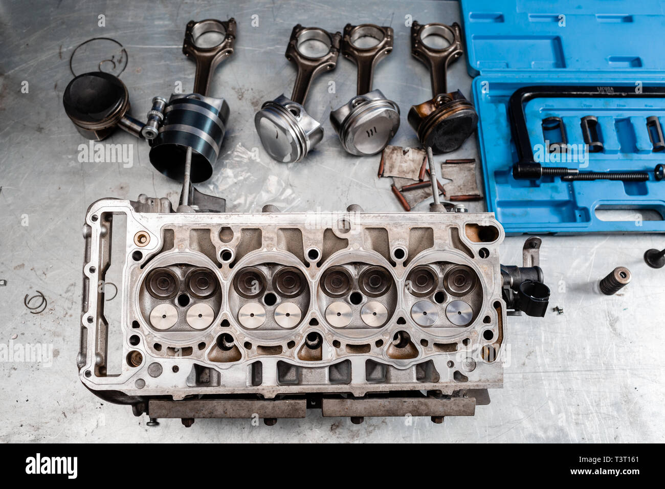 Disassembled engine block is on the table. the mechanic opened the ...