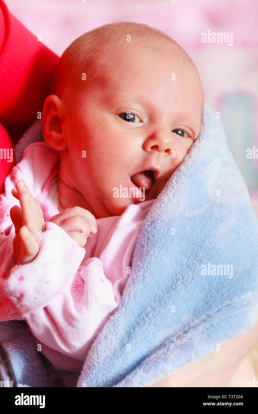 Childhood innocence concept. Little adorable newborn baby lying on bed ...