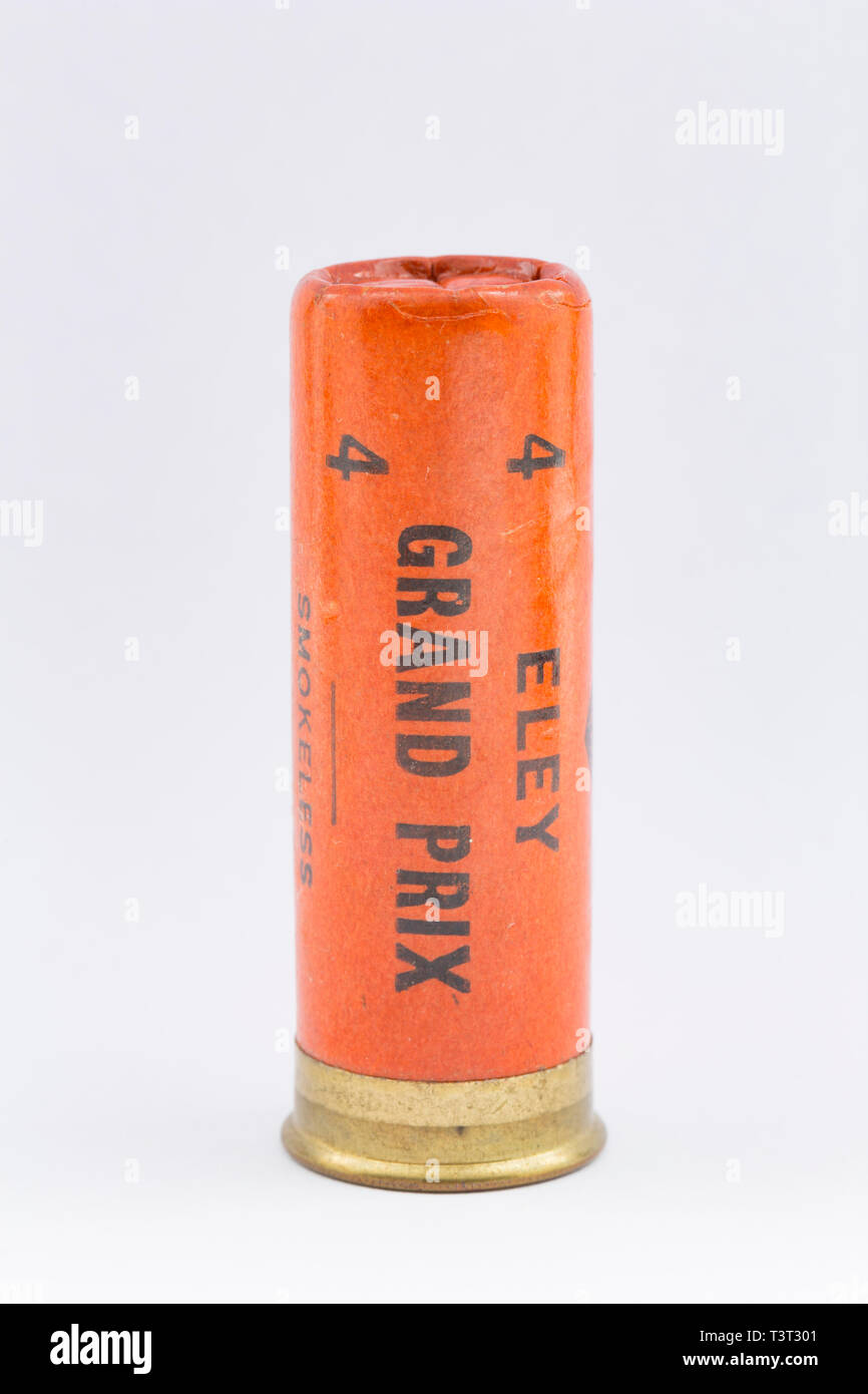 A paper case Eley Grand Prix shotgun cartridge with a crimped closure ...