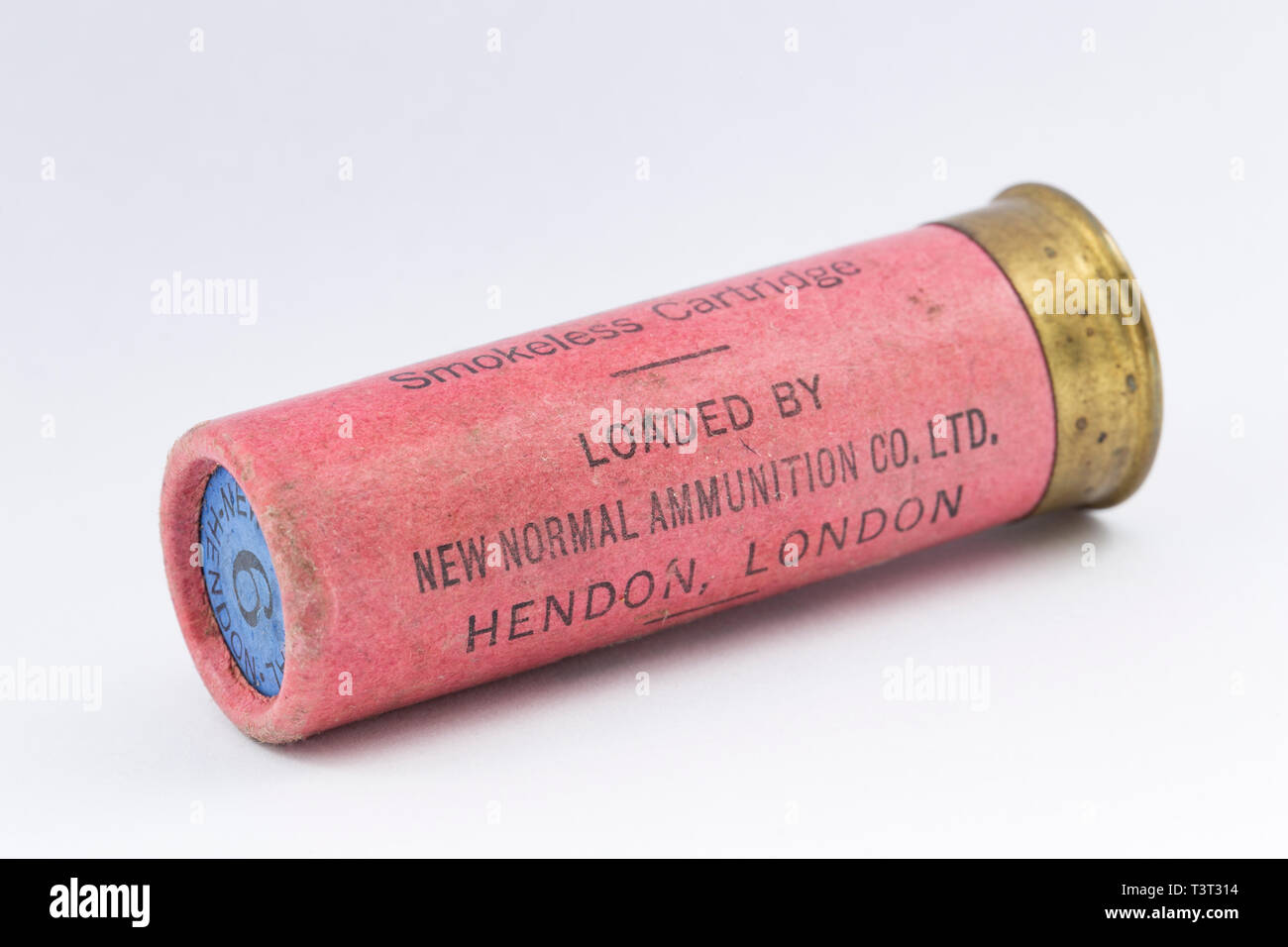 An old paper case 12 gauge shotgun cartridge with a rolled turnover ...