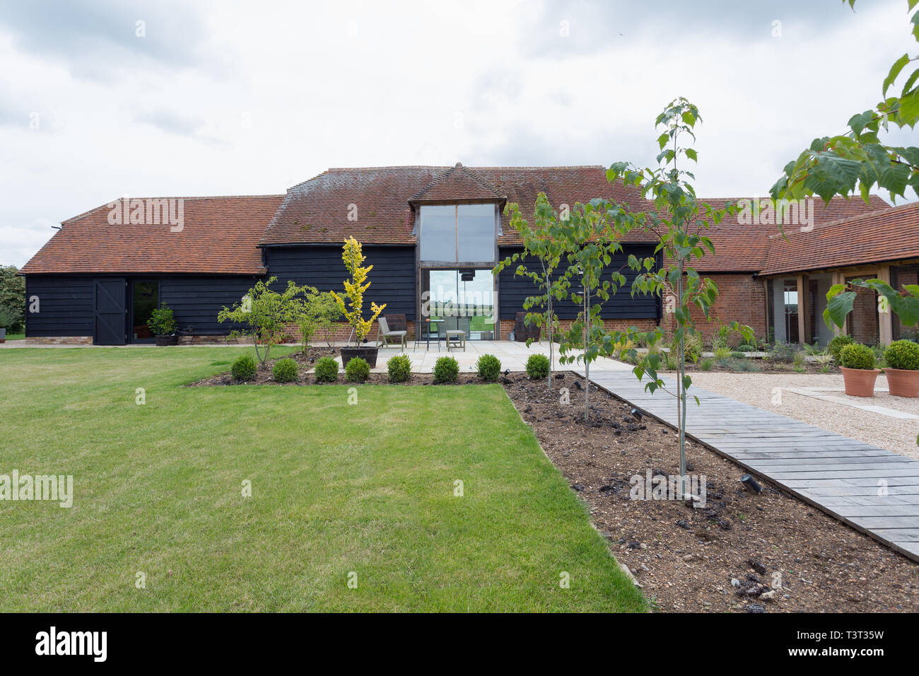 Courtyard of converted barn home Stock Photo - Alamy
