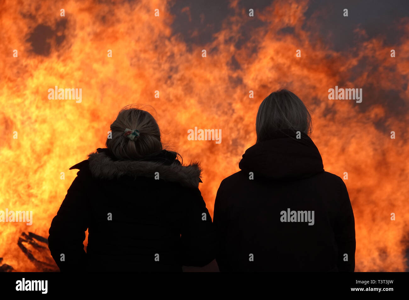 Norway, two young ladies, midsummer night fire Stock Photo - Alamy