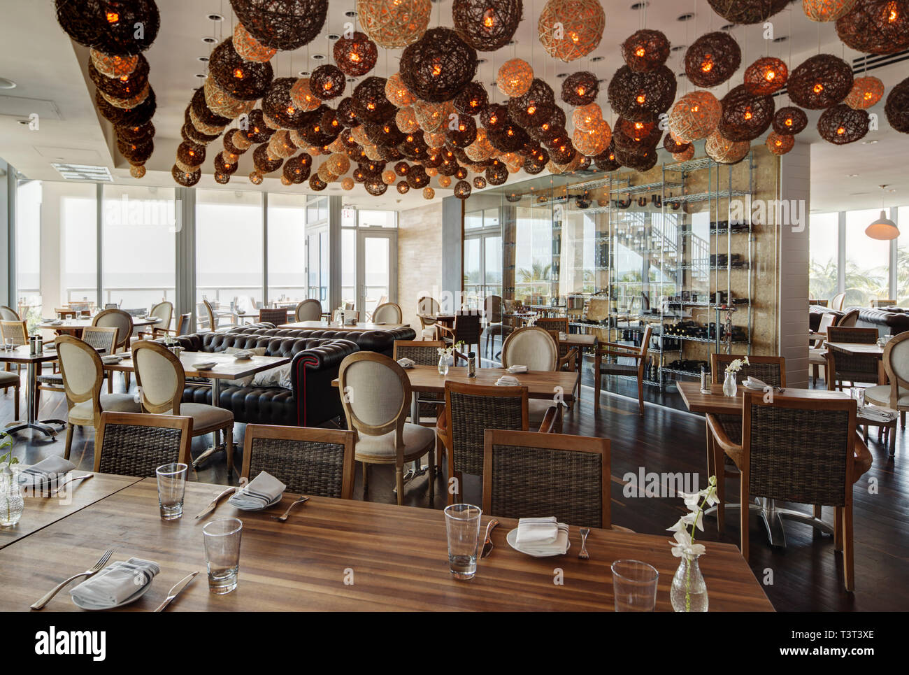 Lanterns over tables in modern restaurant Stock Photo - Alamy