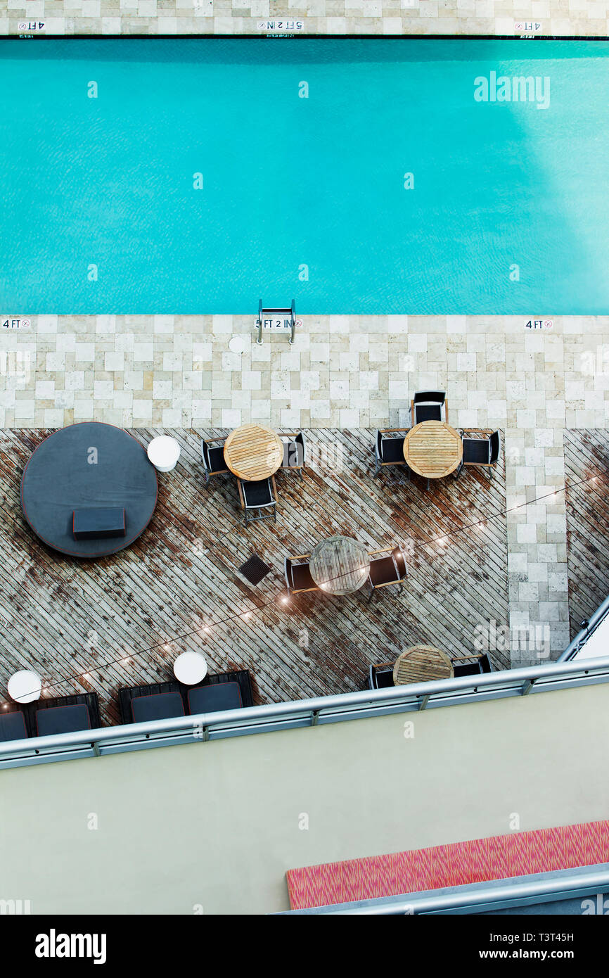 High angle view of tables at hotel swimming pool Stock Photo - Alamy