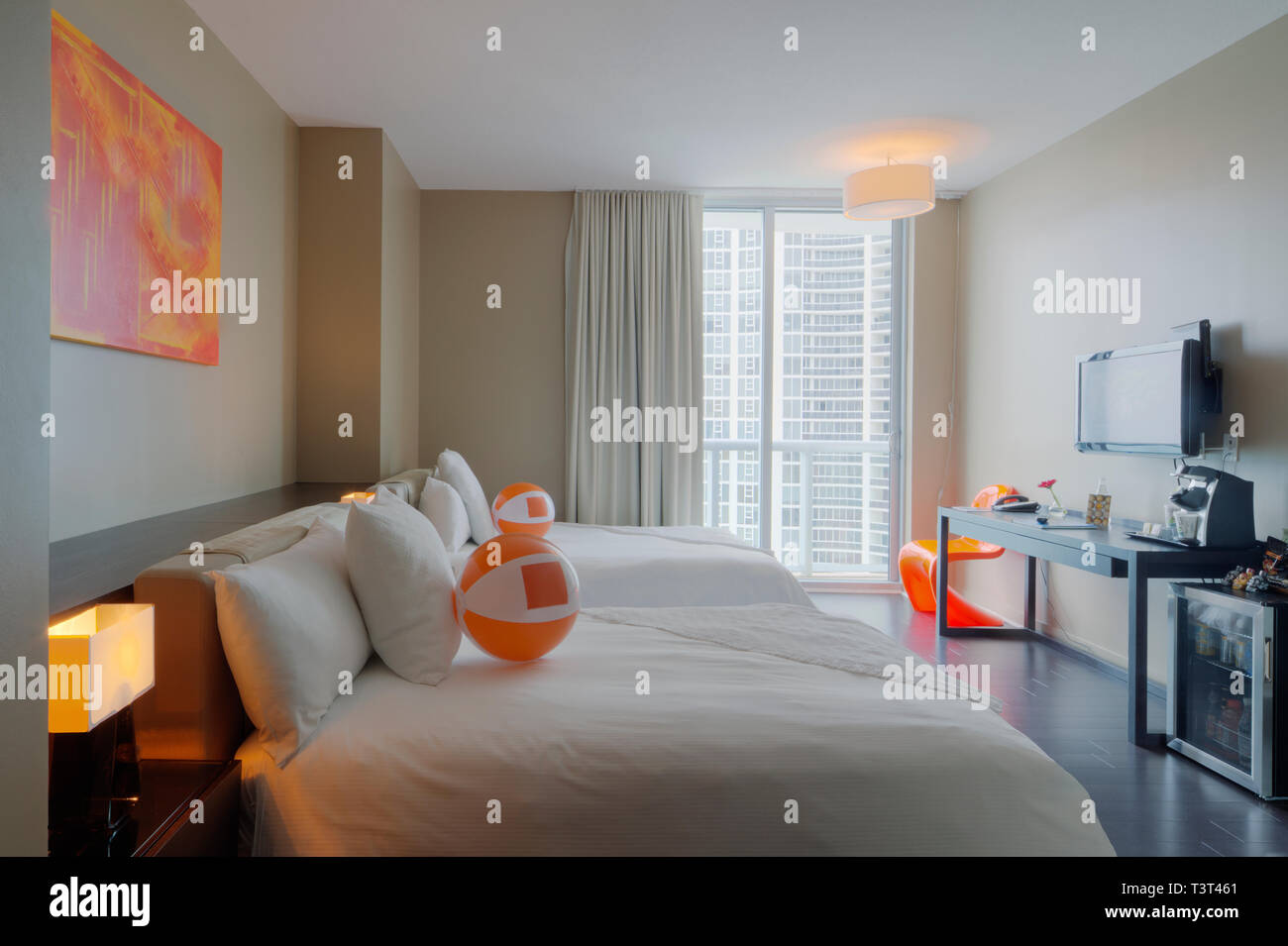 Beach balls on bed in hotel room Stock Photo - Alamy
