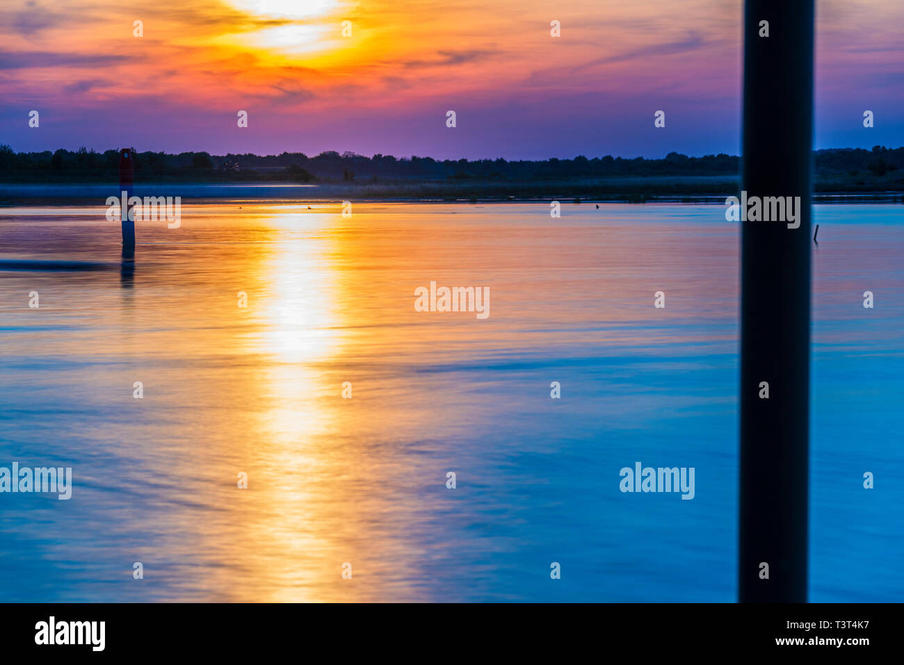 summer twilight over the shoreline inside the lagoon in Bibione, Italy ...