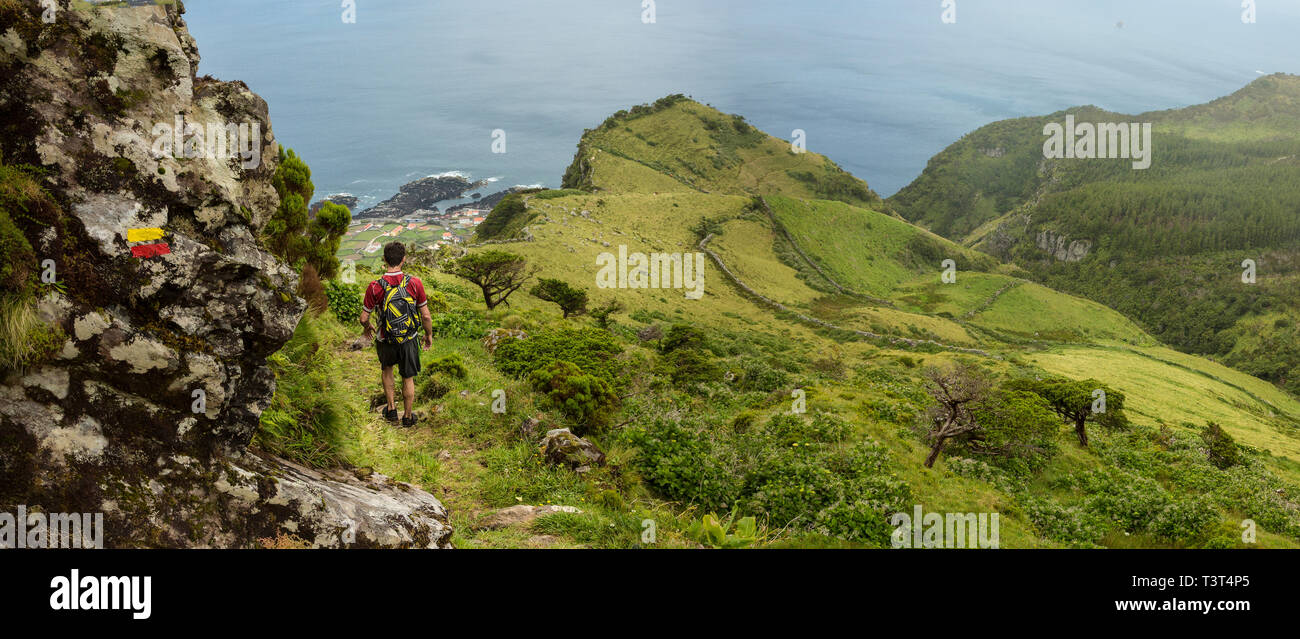 Hiker walking on hilltop path in rural landscape Stock Photo - Alamy