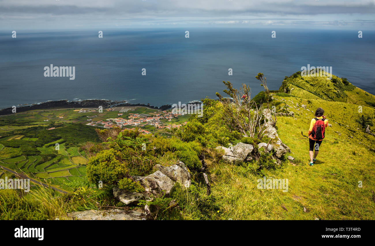 Hiker walking on hilltop path in rural landscape Stock Photo - Alamy