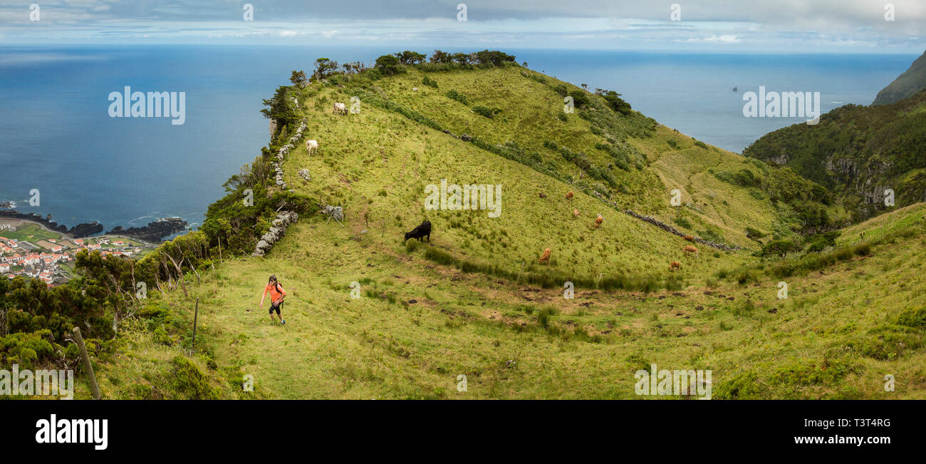 Hiker walking on hilltop path in rural landscape Stock Photo - Alamy