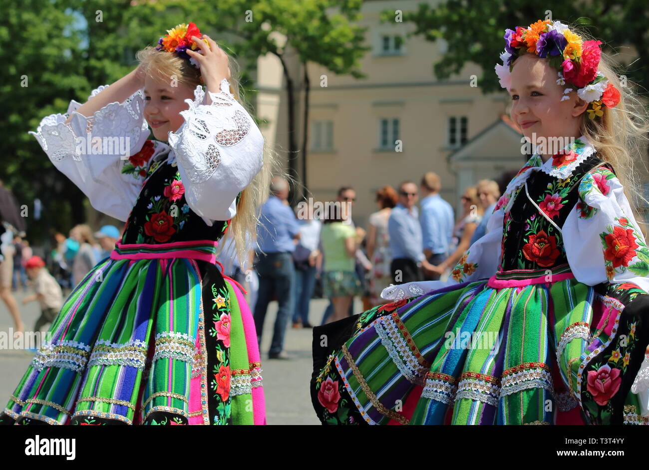 Two sister dressed in traditional folk costumes from lowicz region ...