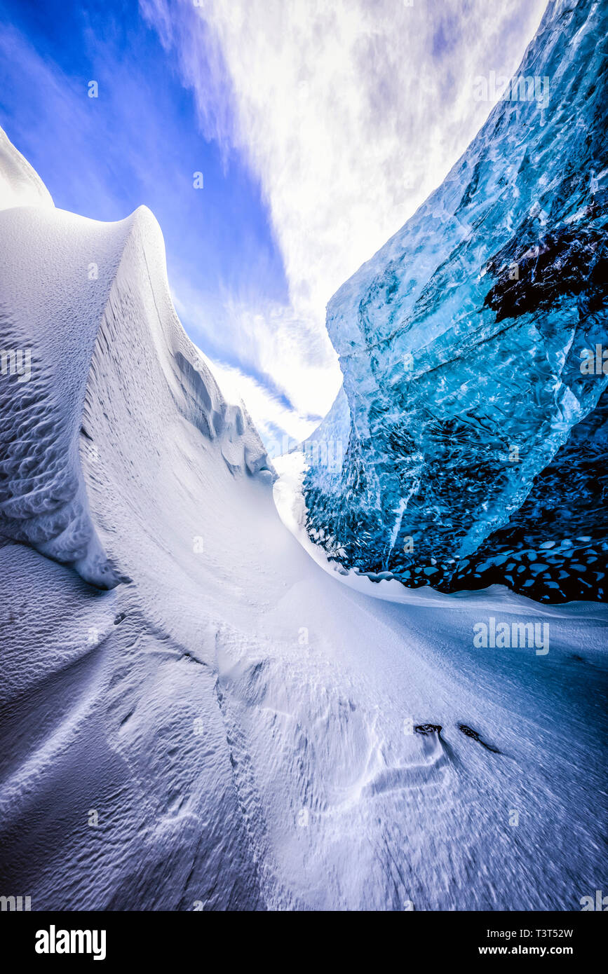 Glass wall of snowy ice cave Stock Photo - Alamy