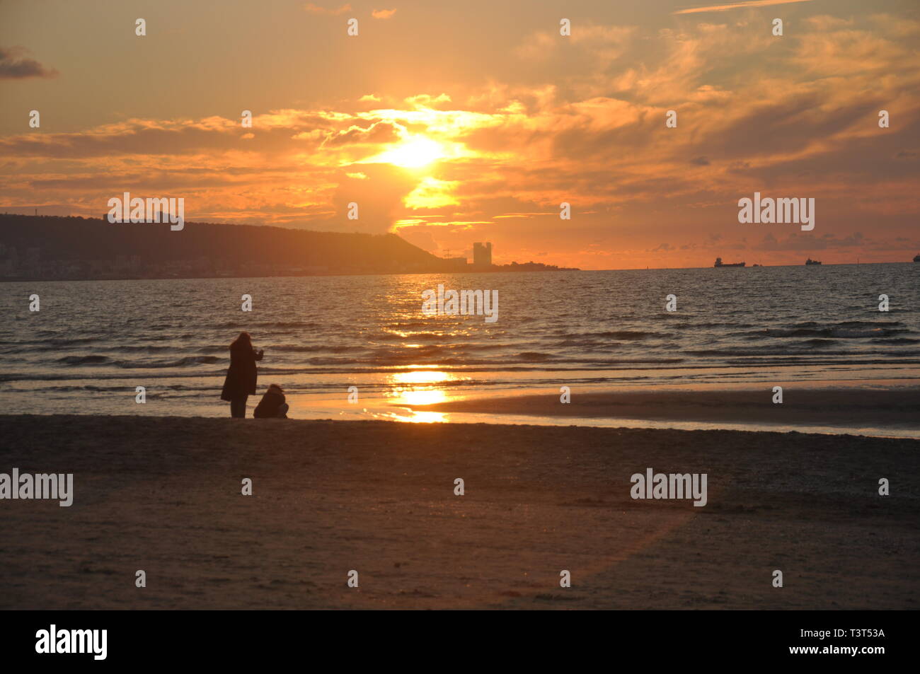Sunset on the beach Stock Photo - Alamy
