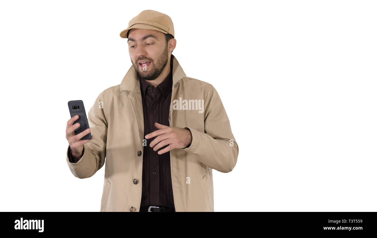 Young man making a video call from his mobile phone while walking on ...