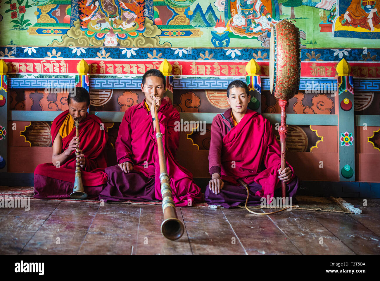 Asian monks playing instruments on temple floor Stock Photo - Alamy