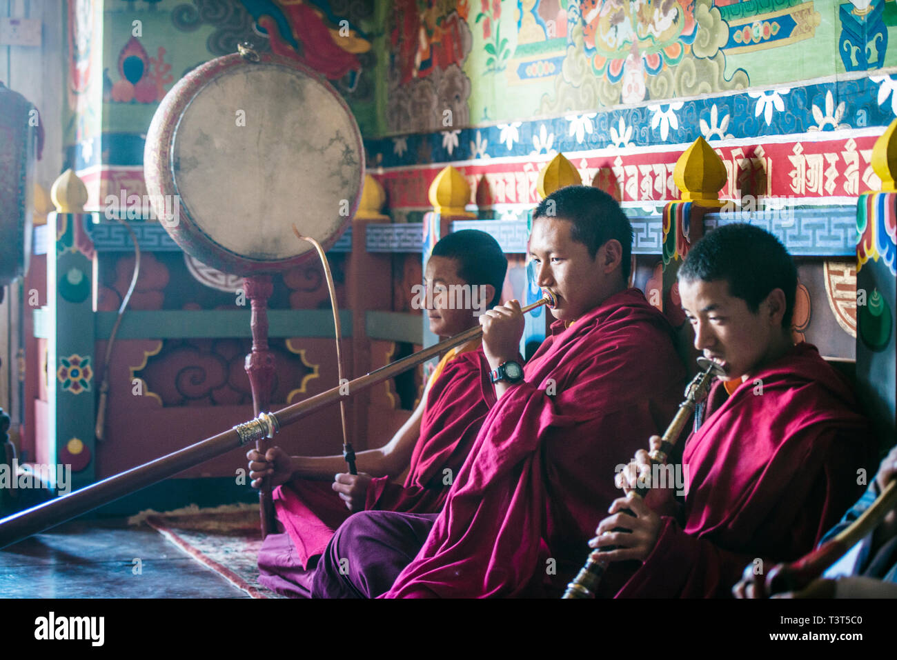 Asian monks playing instruments on temple floor Stock Photo - Alamy