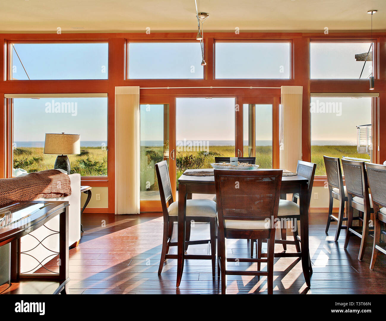 Ocean view through window in dining room Stock Photo - Alamy