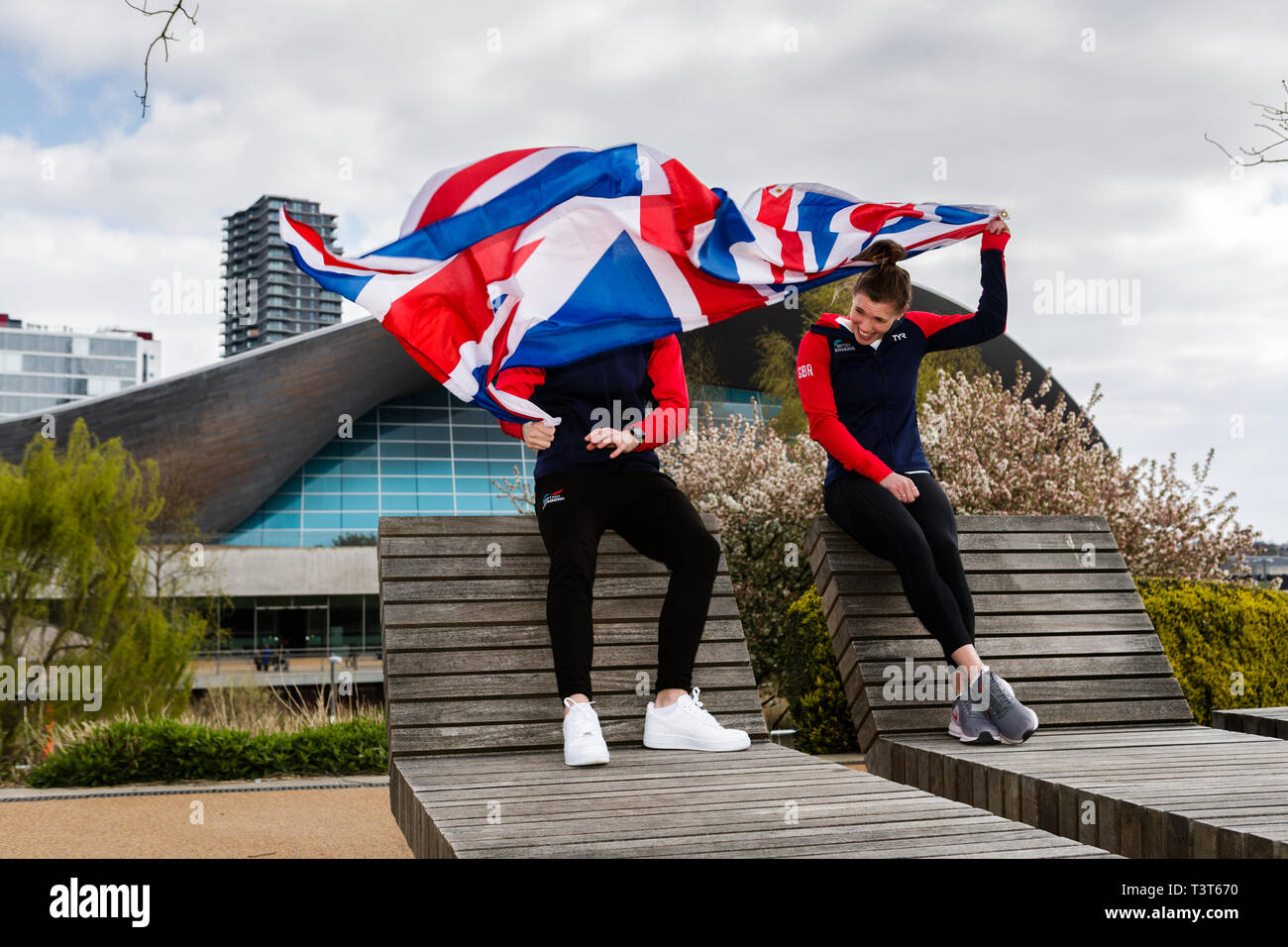 Matty Lee and Grace Reid as the wind catches the flag during the Team ...