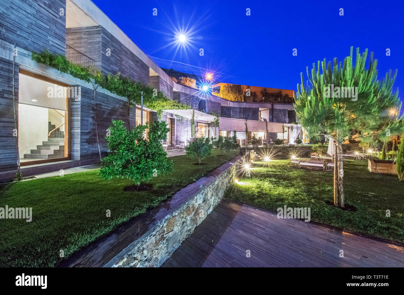 Modern hotel illuminated at night Stock Photo - Alamy