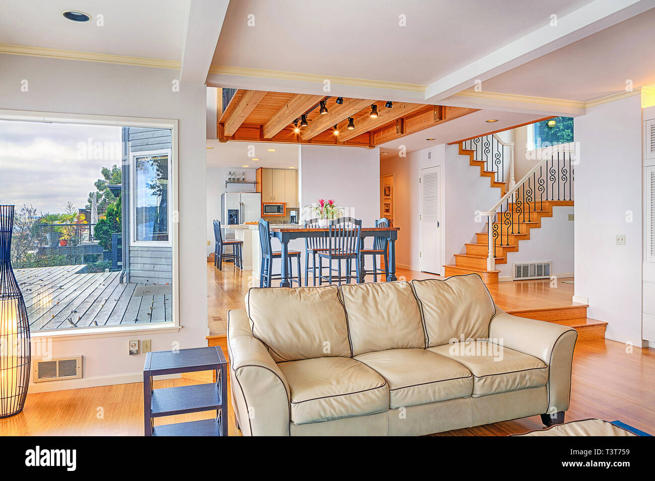 Sofa and dining table in modern living space Stock Photo - Alamy