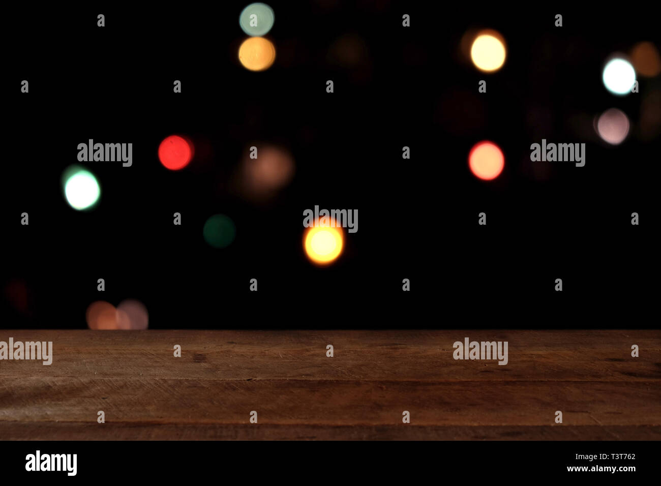 abstract blurred background image of wooden table in front of resturant ...