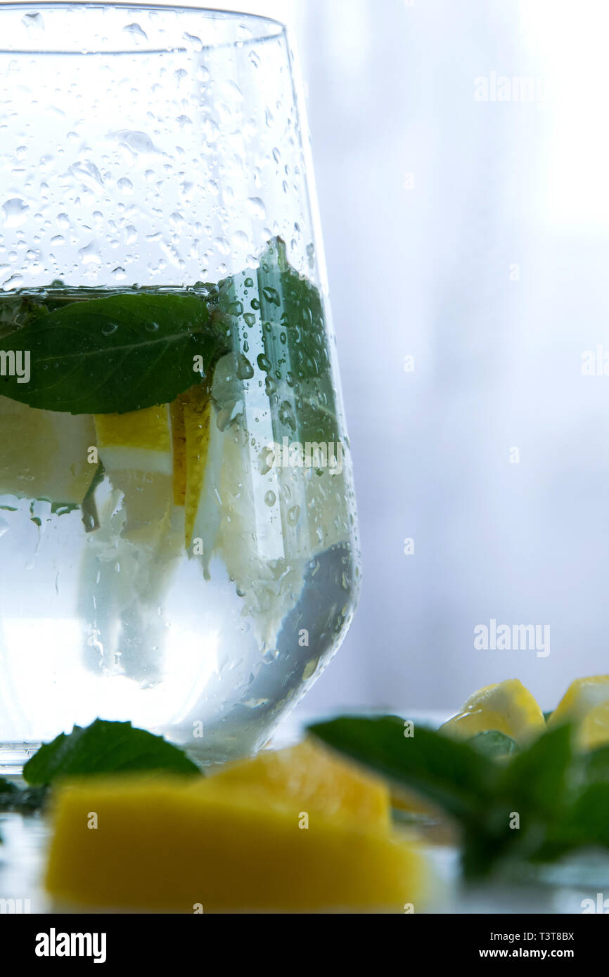 Refreshment ice drink/cocktail with raw lemons and mint Stock Photo - Alamy