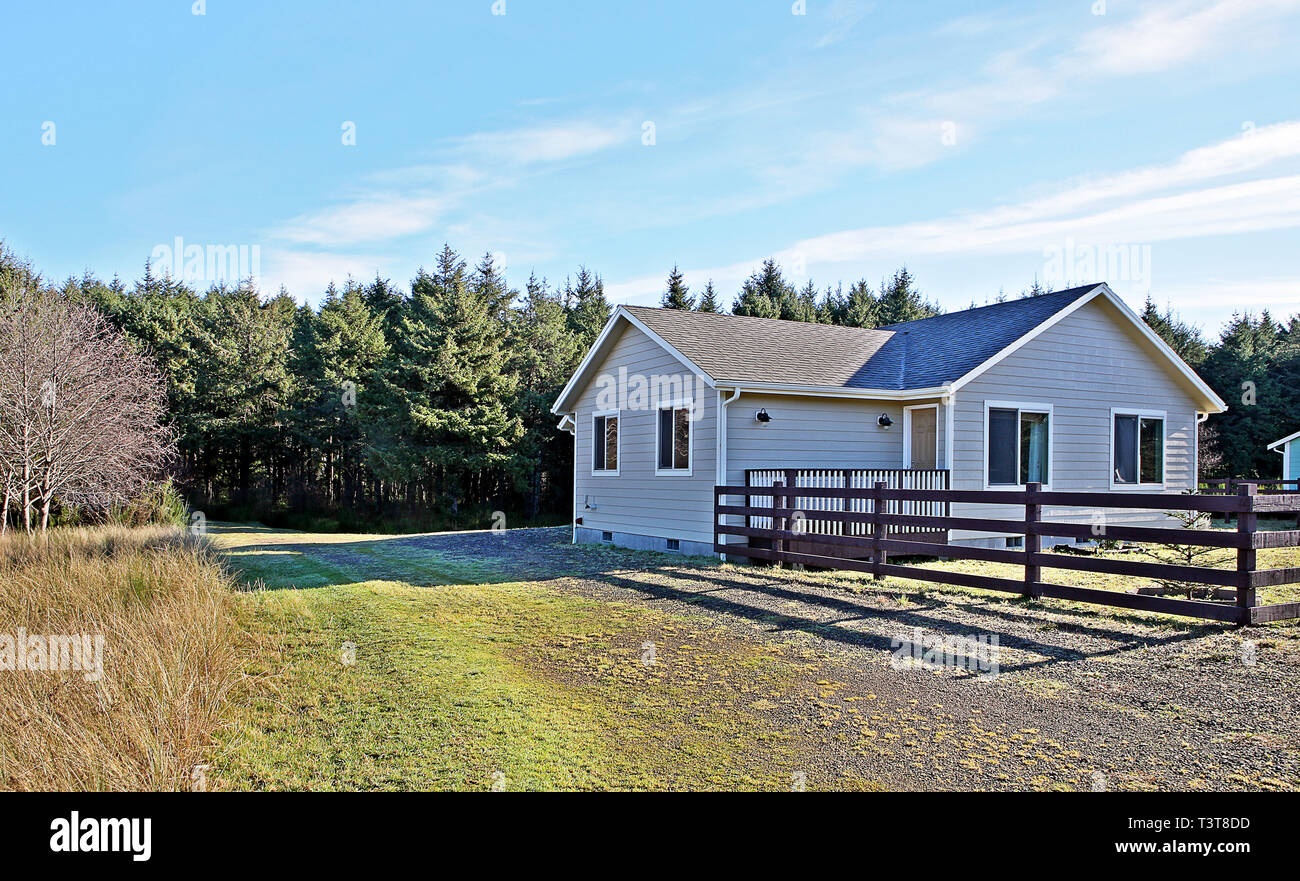 House and fenced yard in rural setting Stock Photo - Alamy