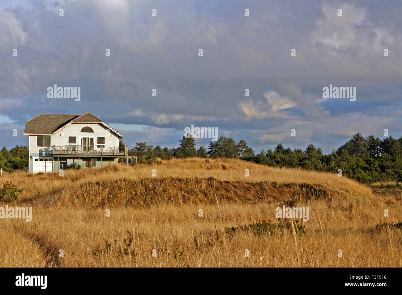 Rustic house in rural field Stock Photo - Alamy