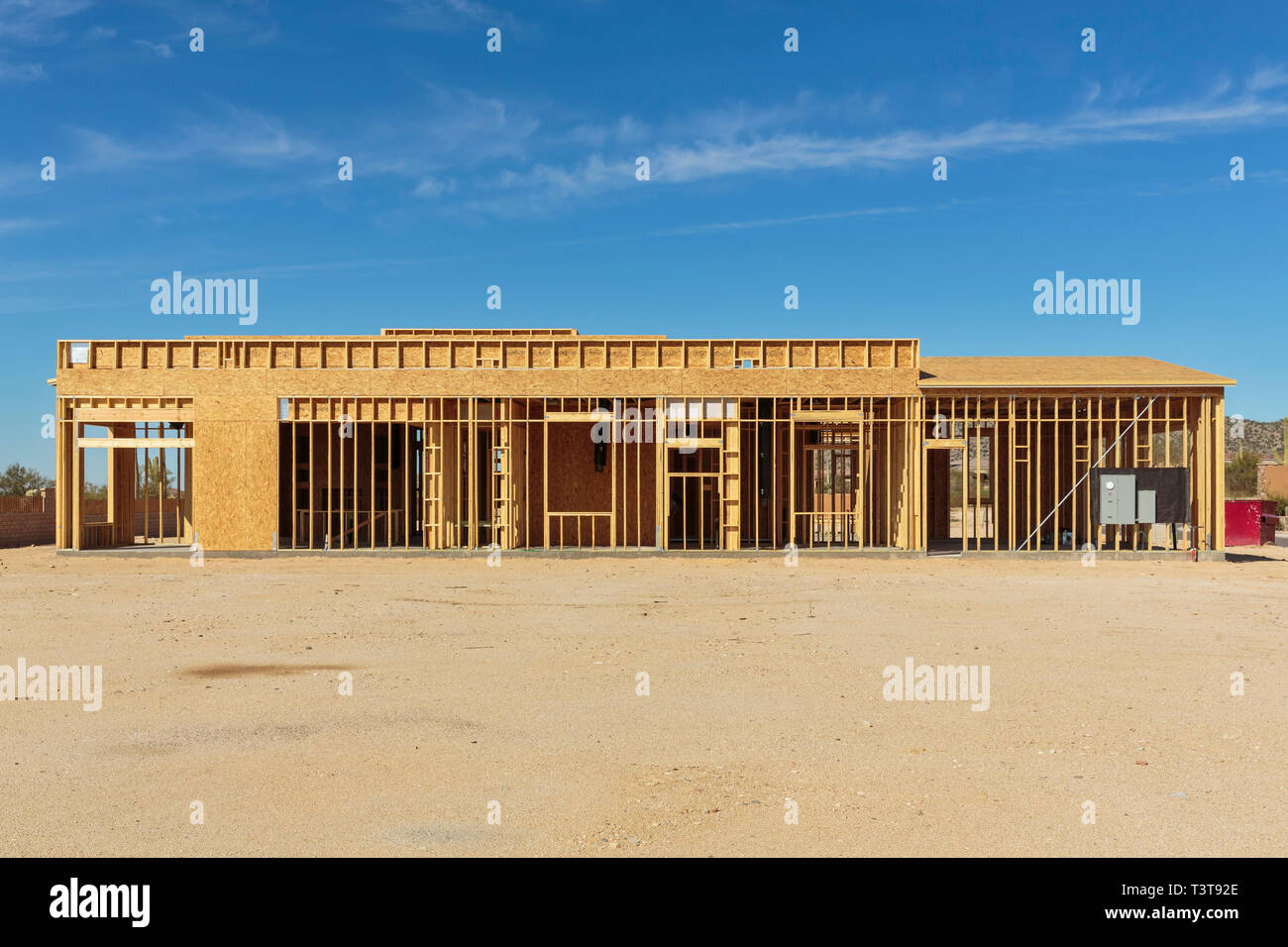Construction of house under blue sky Stock Photo - Alamy