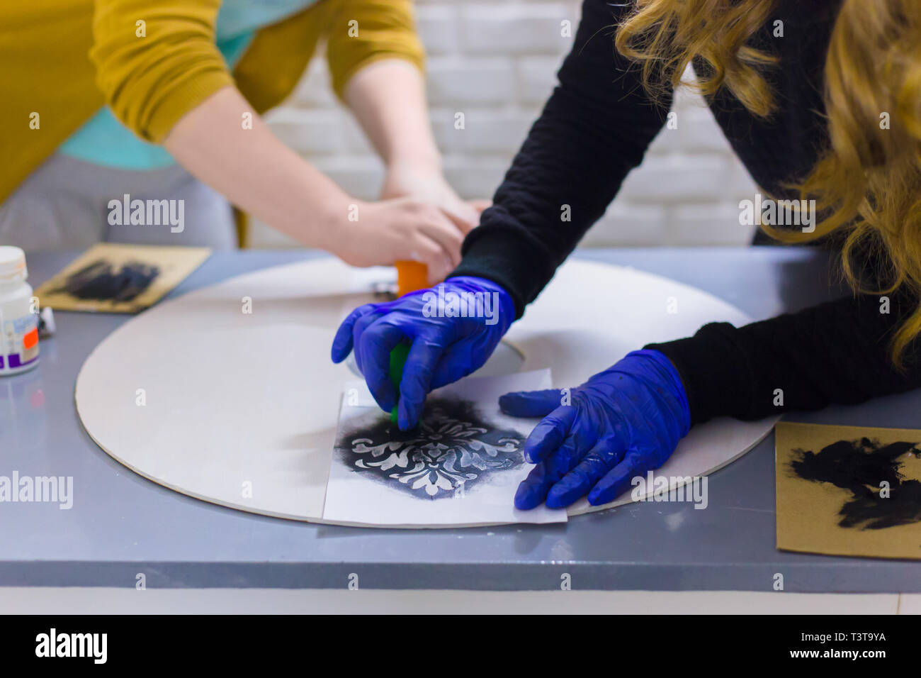 Women hands painting wooden circle Stock Photo - Alamy