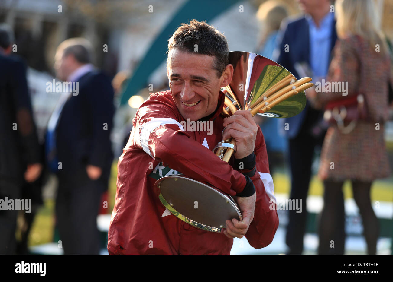 Jockey Davy Russell celebrates with the trophy after winning the Randox ...