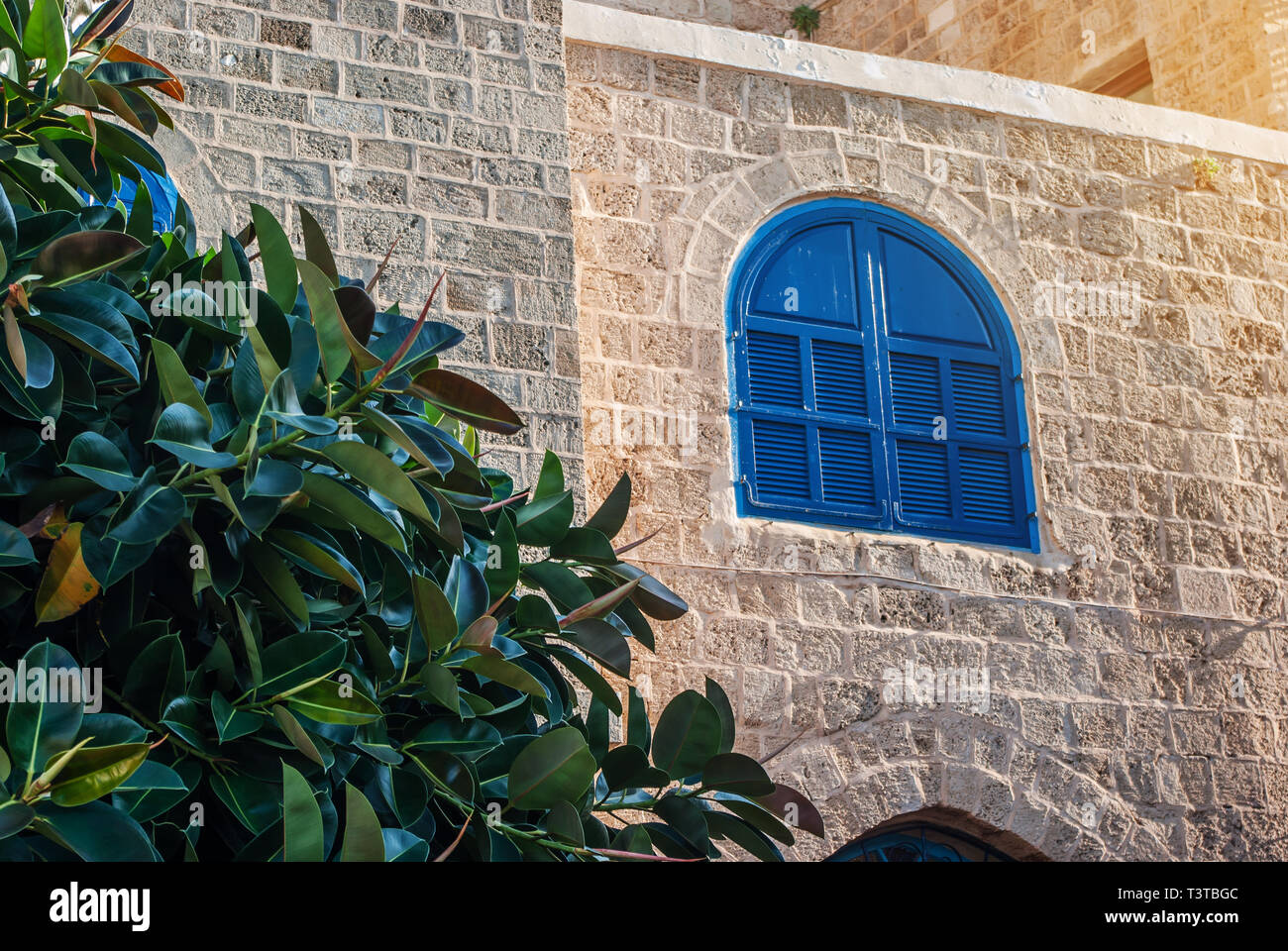 Old house in Israel with windows with blue shutters. Historical ...