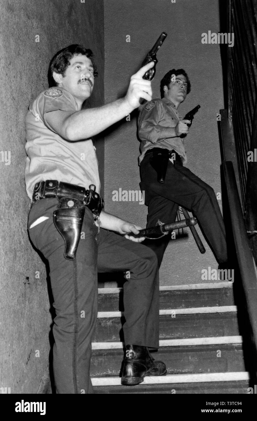 28th Precinct, New York policeman with guns drawn in Harlem 70s, USA ...