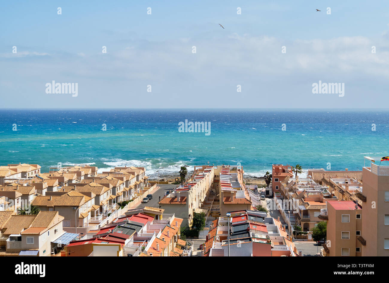 Coastal houses rooftops and view turquoise Mediterranean Sea horizon ...