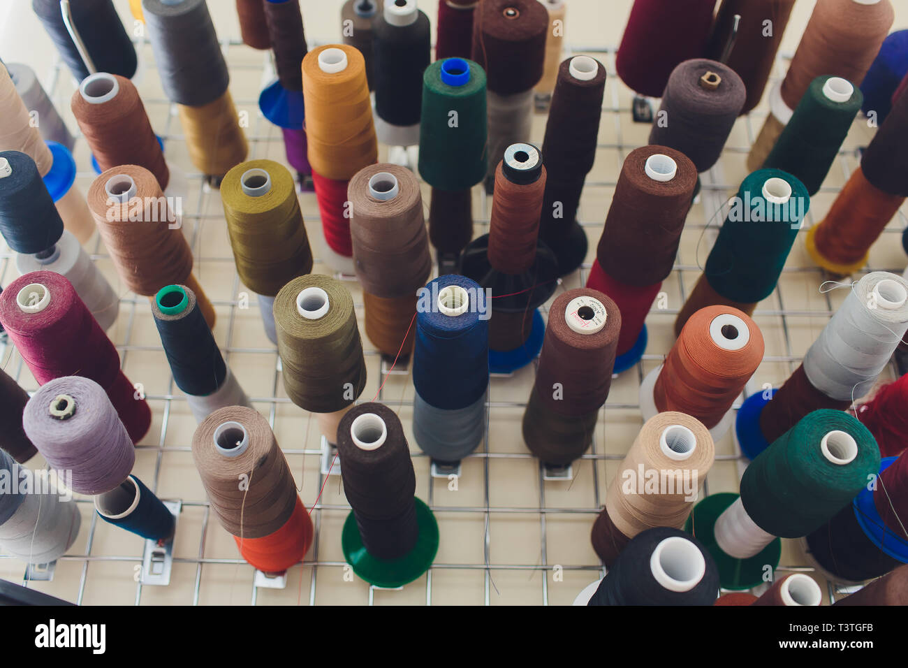 Image of a lot of coils with multi-colored threads Stock Photo - Alamy