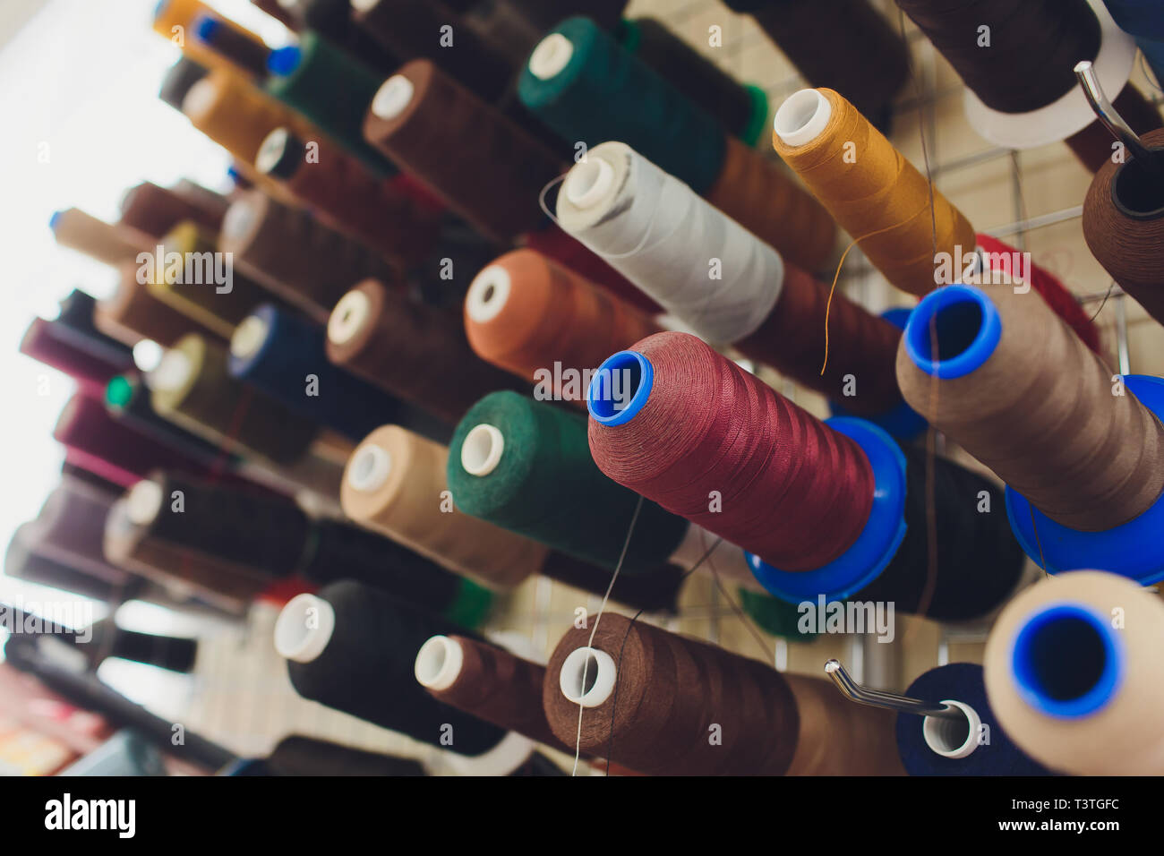 Image of a lot of coils with multi-colored threads Stock Photo - Alamy