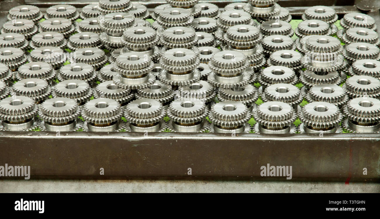 New steel gears, factory interior Stock Photo - Alamy