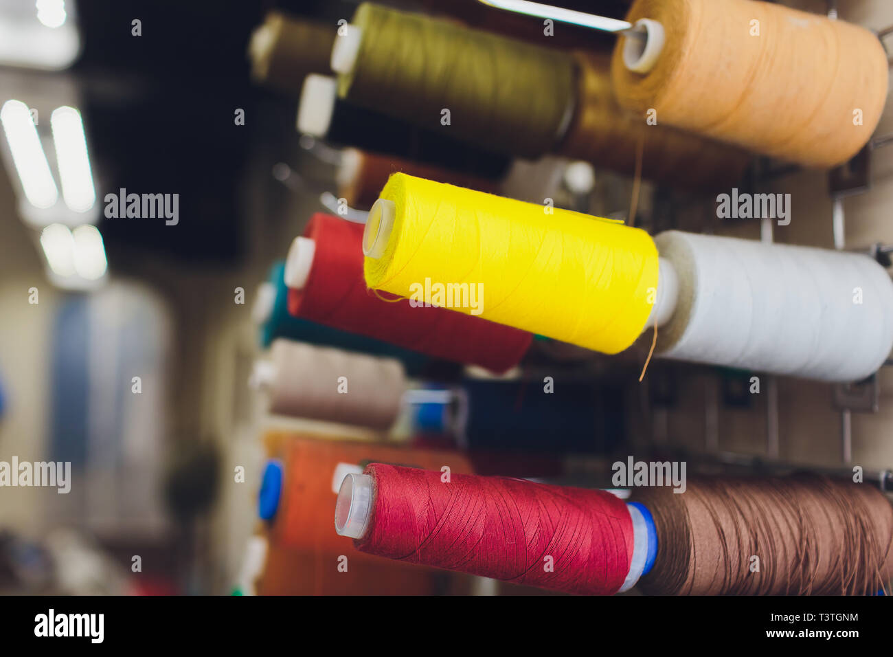 Image of a lot of coils with multi-colored threads Stock Photo - Alamy