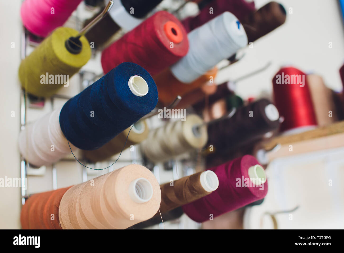 Image of a lot of coils with multi-colored threads Stock Photo - Alamy