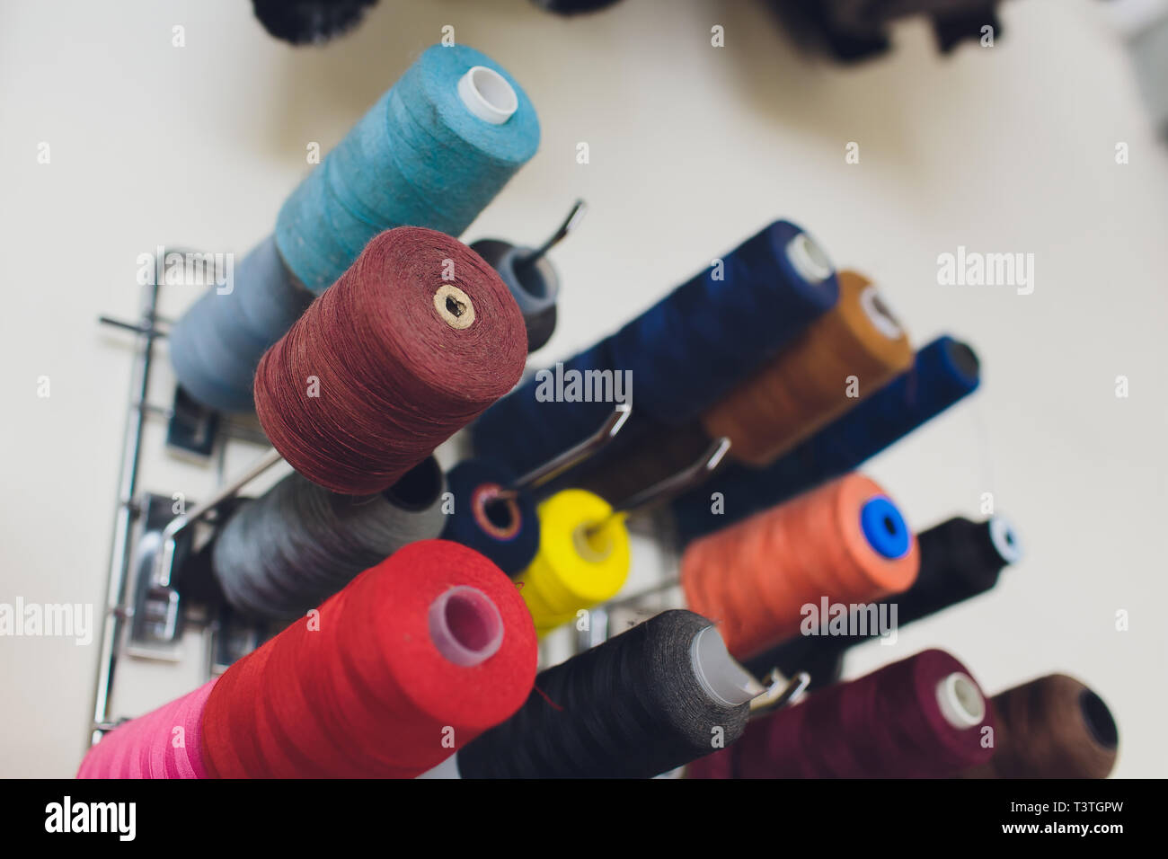 Image of a lot of coils with multi-colored threads Stock Photo - Alamy