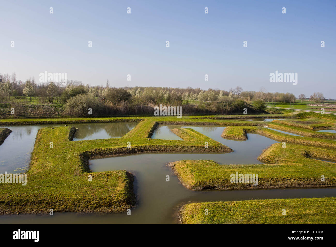 Dutch nature reserve with green landscape and long calm river Stock ...