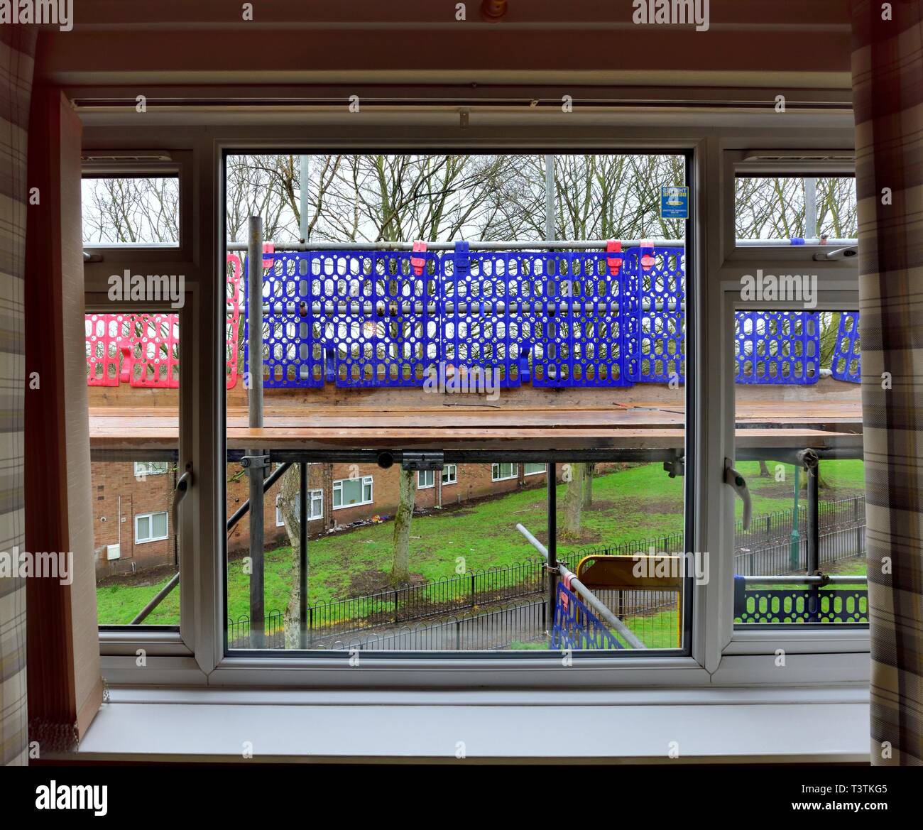 UK Residential flat window with Scaffolding erected outside Stock Photo ...