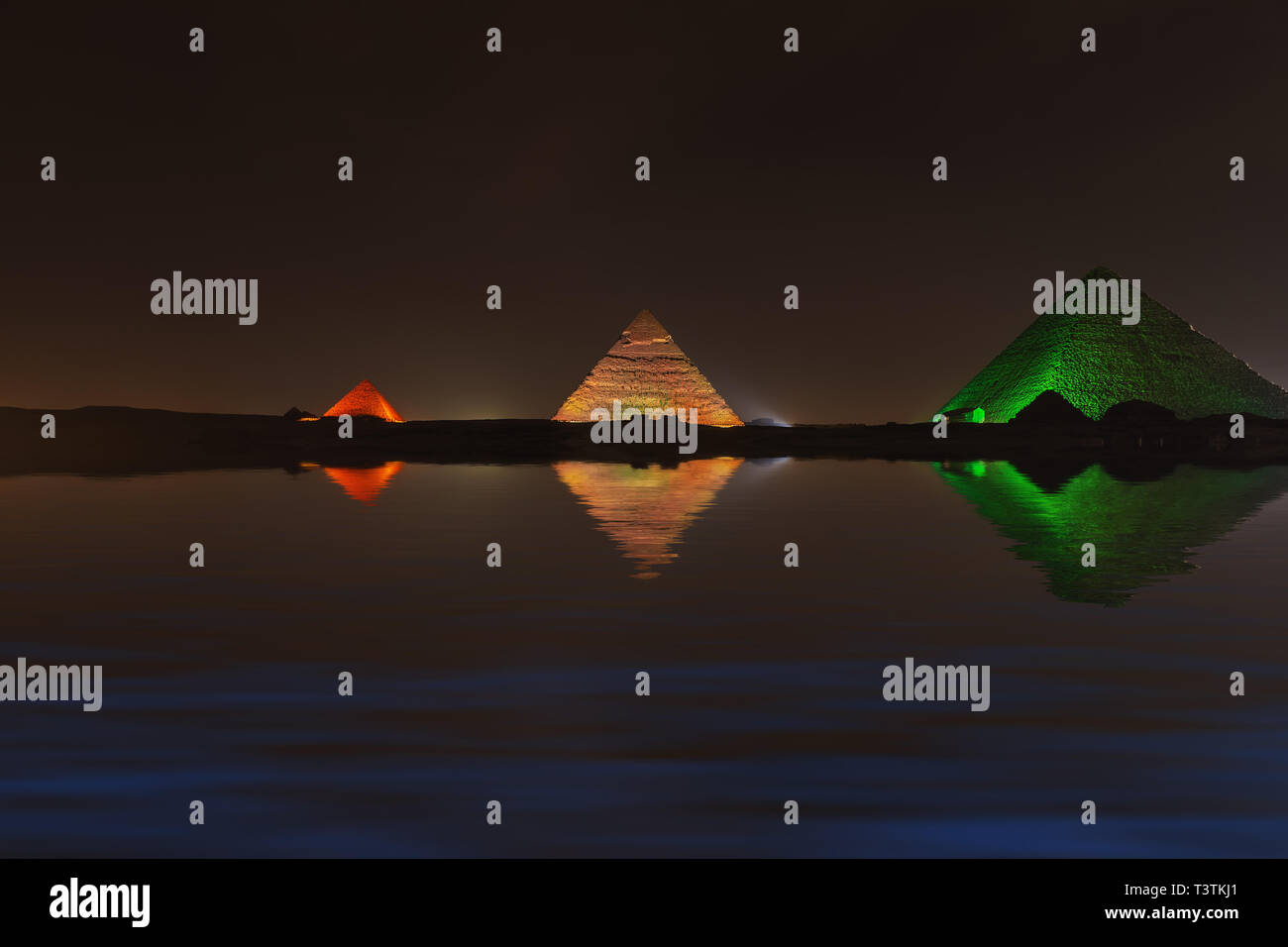Great Giza pyramids at night, water reflection Stock Photo - Alamy