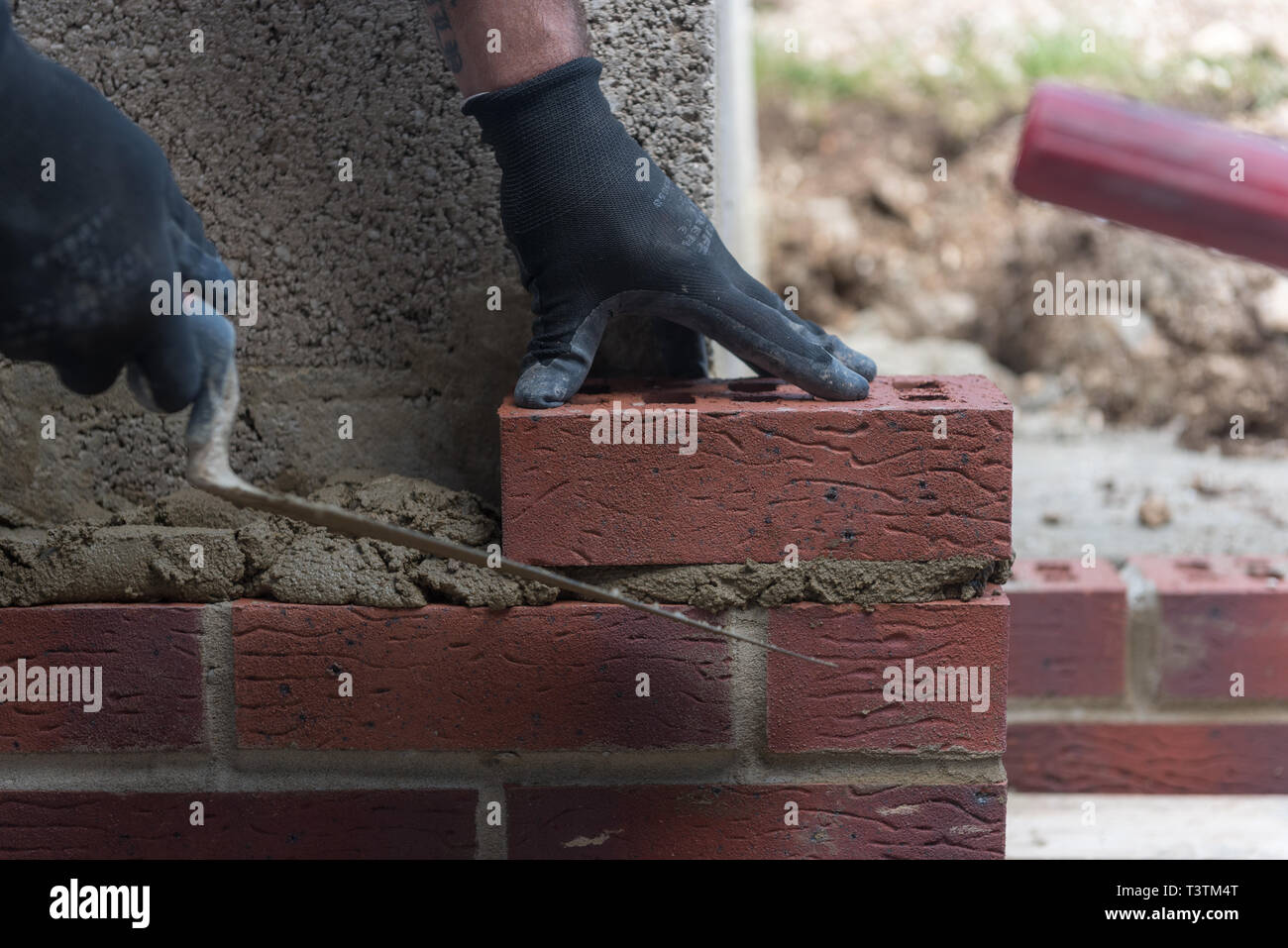 brick laying close up of hands and trowel Stock Photo - Alamy