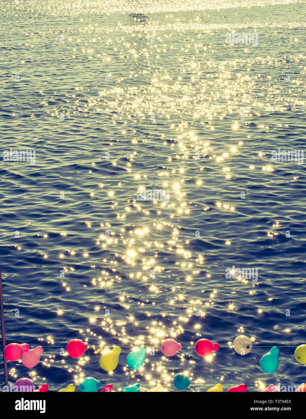 Balloon on a string on water for shooting game Stock Photo - Alamy