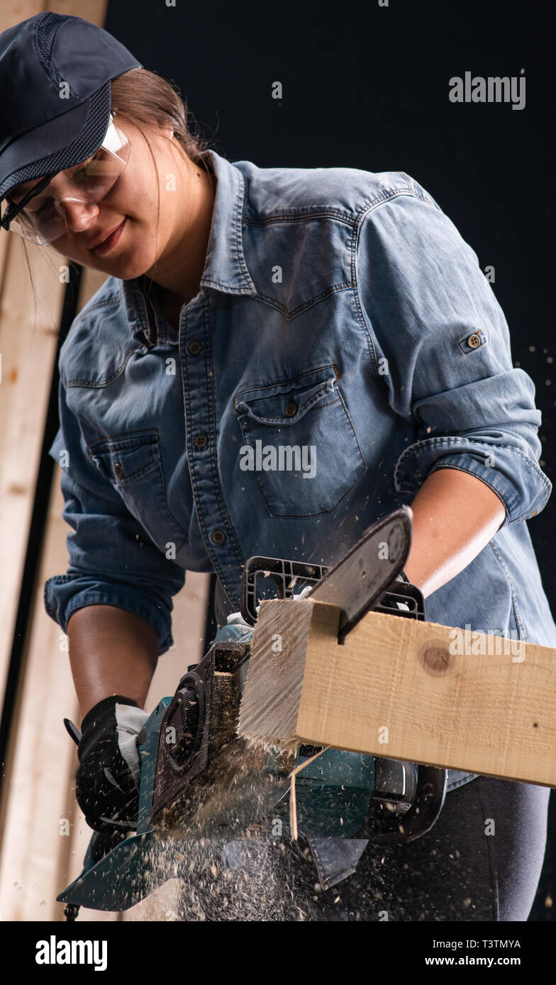 Female wood cutter hi-res stock photography and images - Alamy