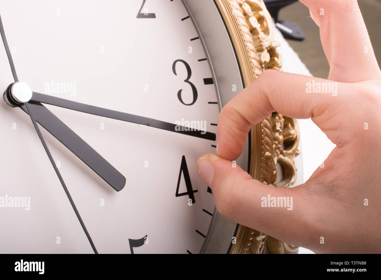hand in touch with a clock on a white background Stock Photo - Alamy